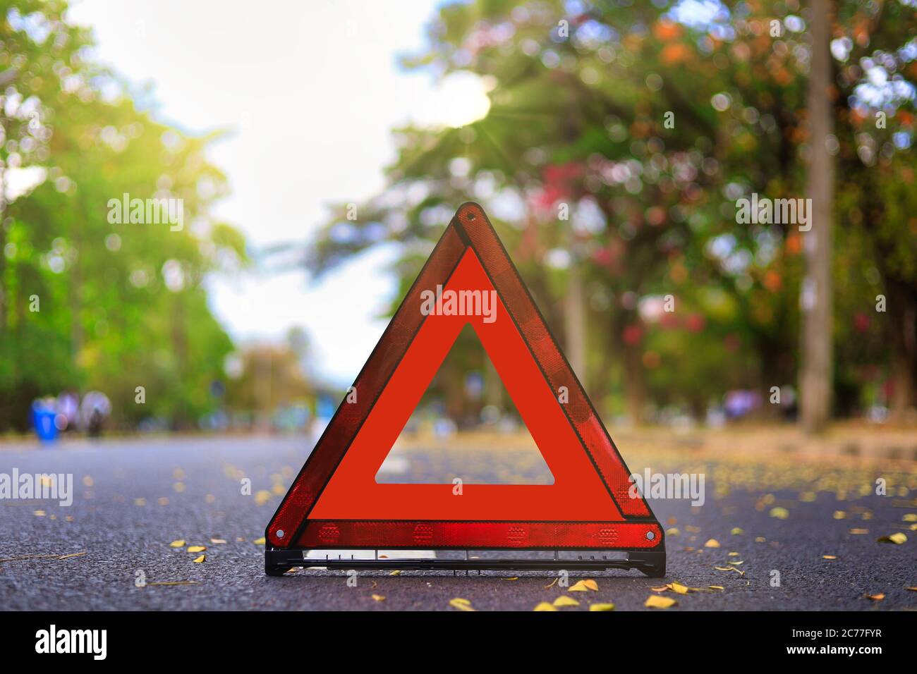 Red triangle, red emergency stop sign, red emergency symbol on road ...