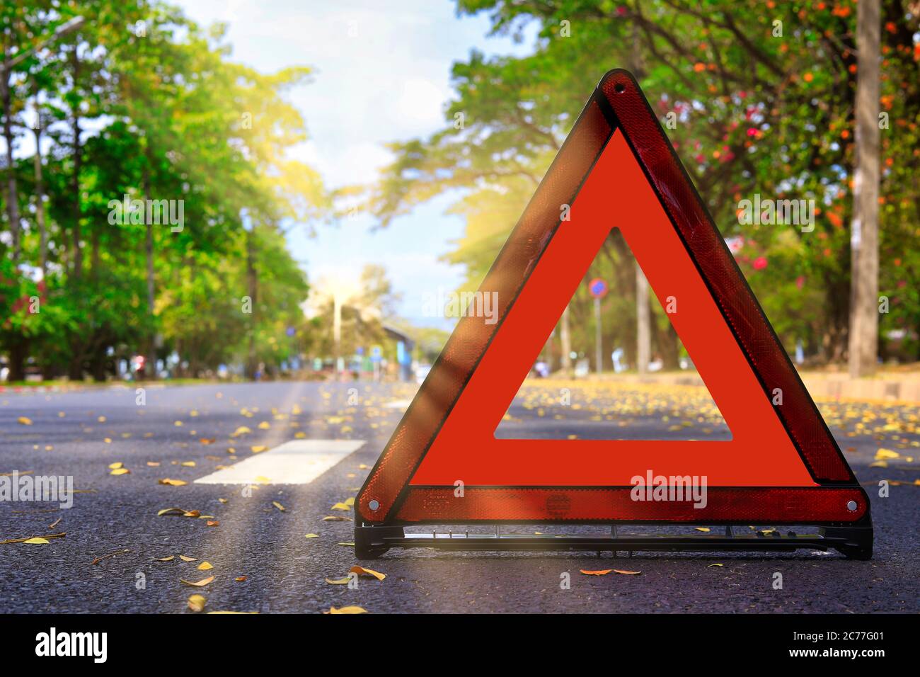 Red triangle, red emergency stop sign, red emergency symbol on road ...