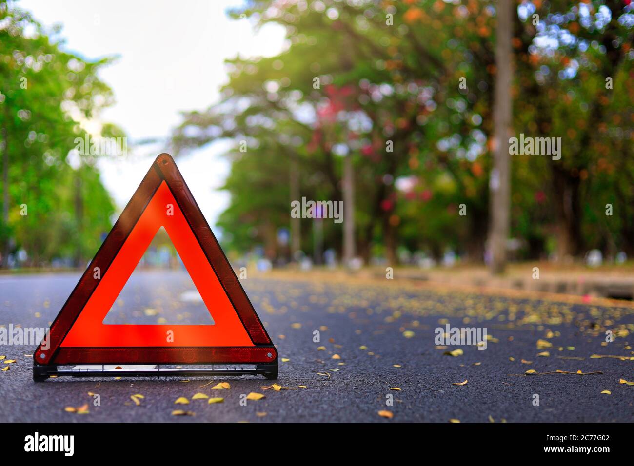Red triangle, red emergency stop sign, red emergency symbol on road ...