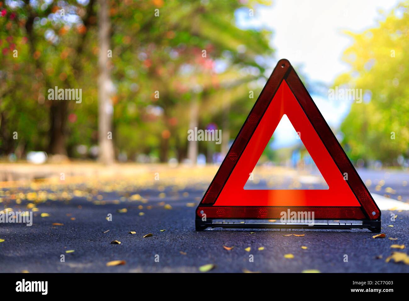 Red triangle, red emergency stop sign, red emergency symbol on road ...
