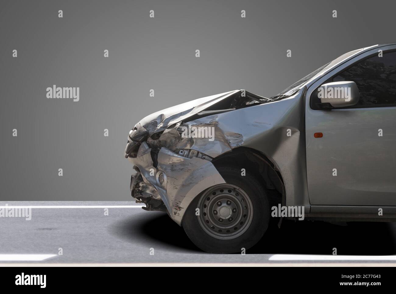 Front of gray color car damaged and broken by accident isolated on gray ...