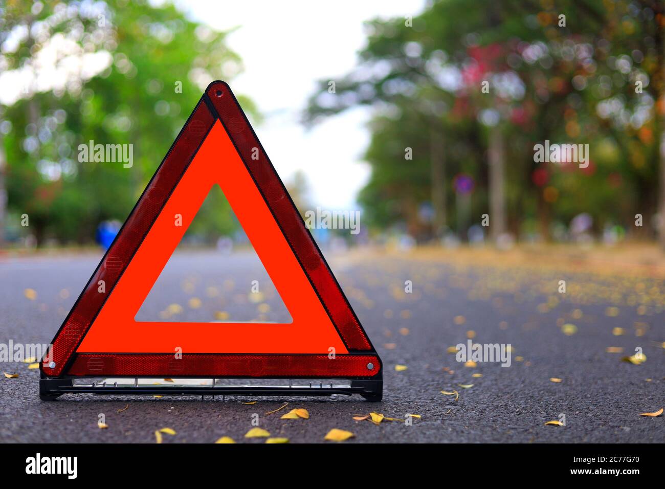 Red triangle, red emergency stop sign, red emergency symbol on road ...