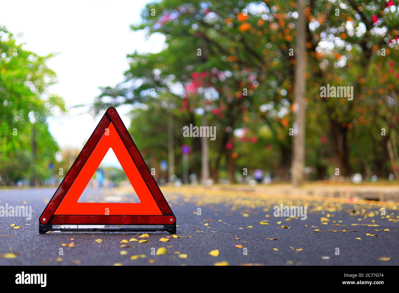 Red triangle, red emergency stop sign, red emergency symbol on road ...