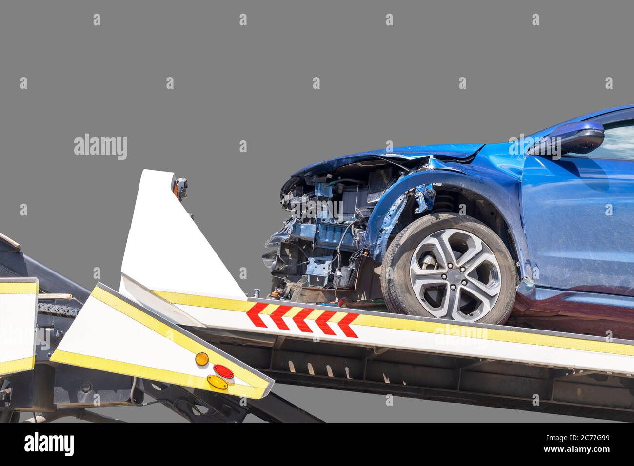 accident Car Slide on truck for move. Blue car have damage by accident ...