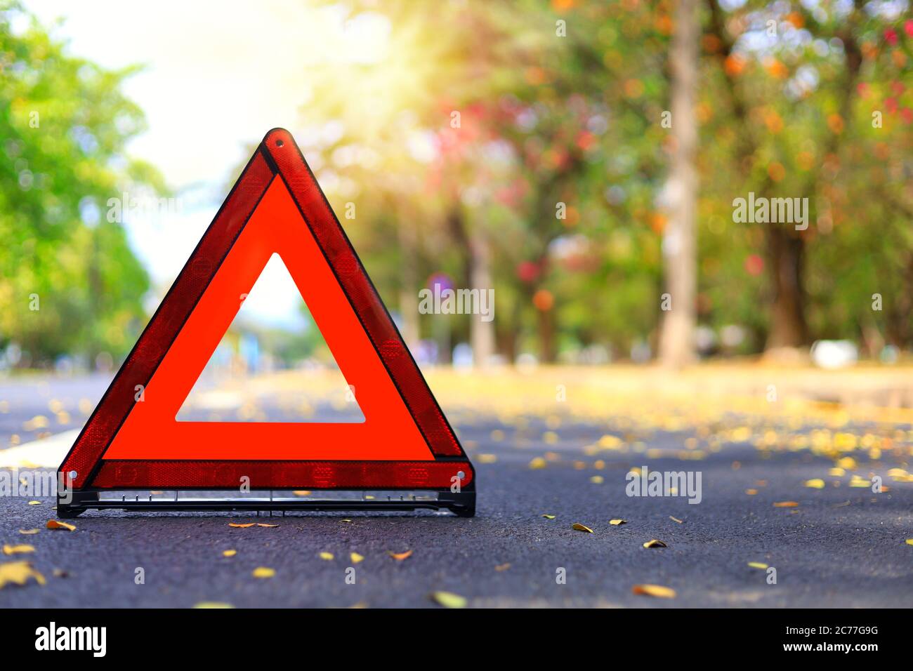 Red triangle, red emergency stop sign, red emergency symbol on road ...