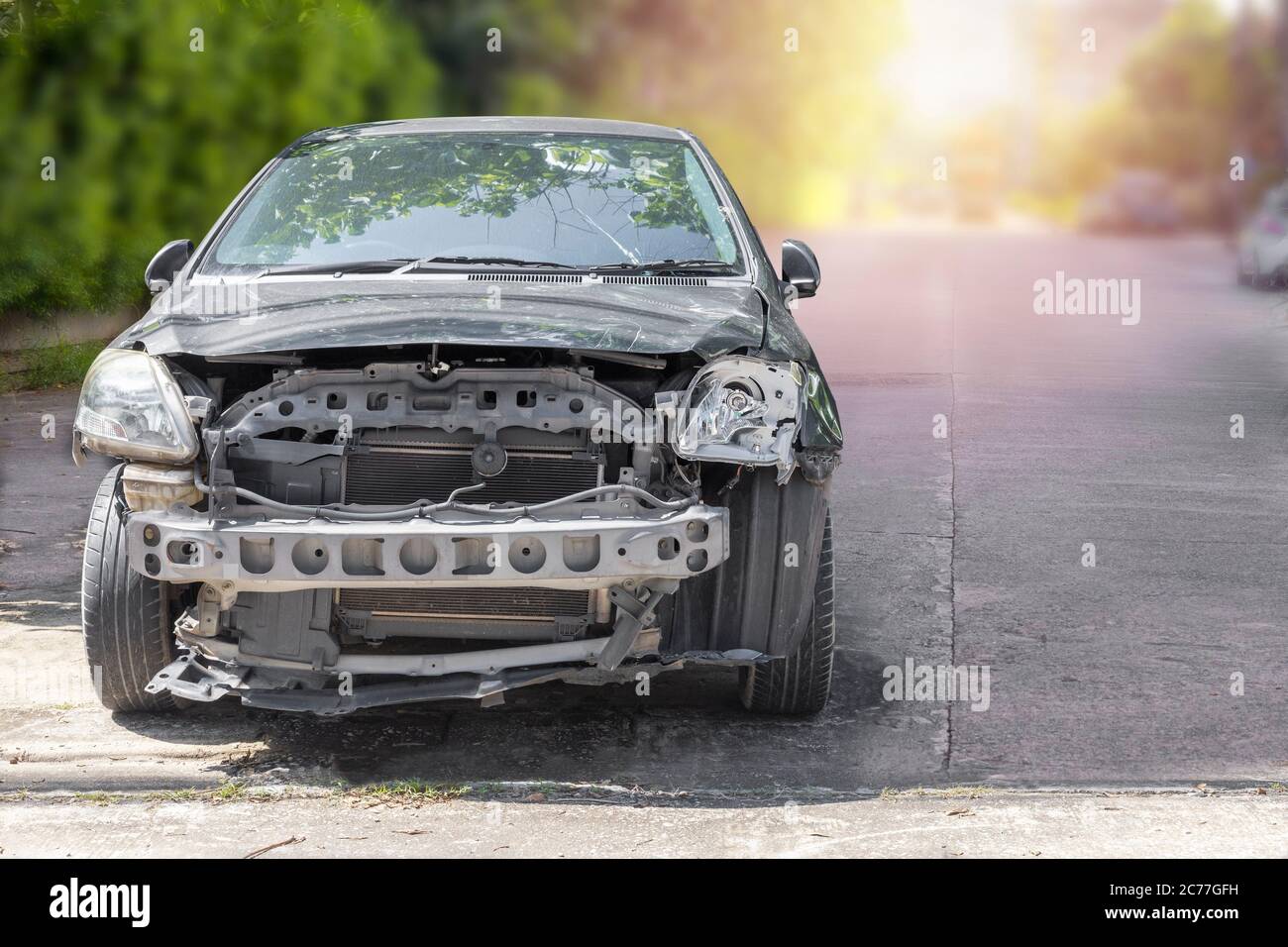 Front of black color car damaged and broken by accident . Isolate on ...