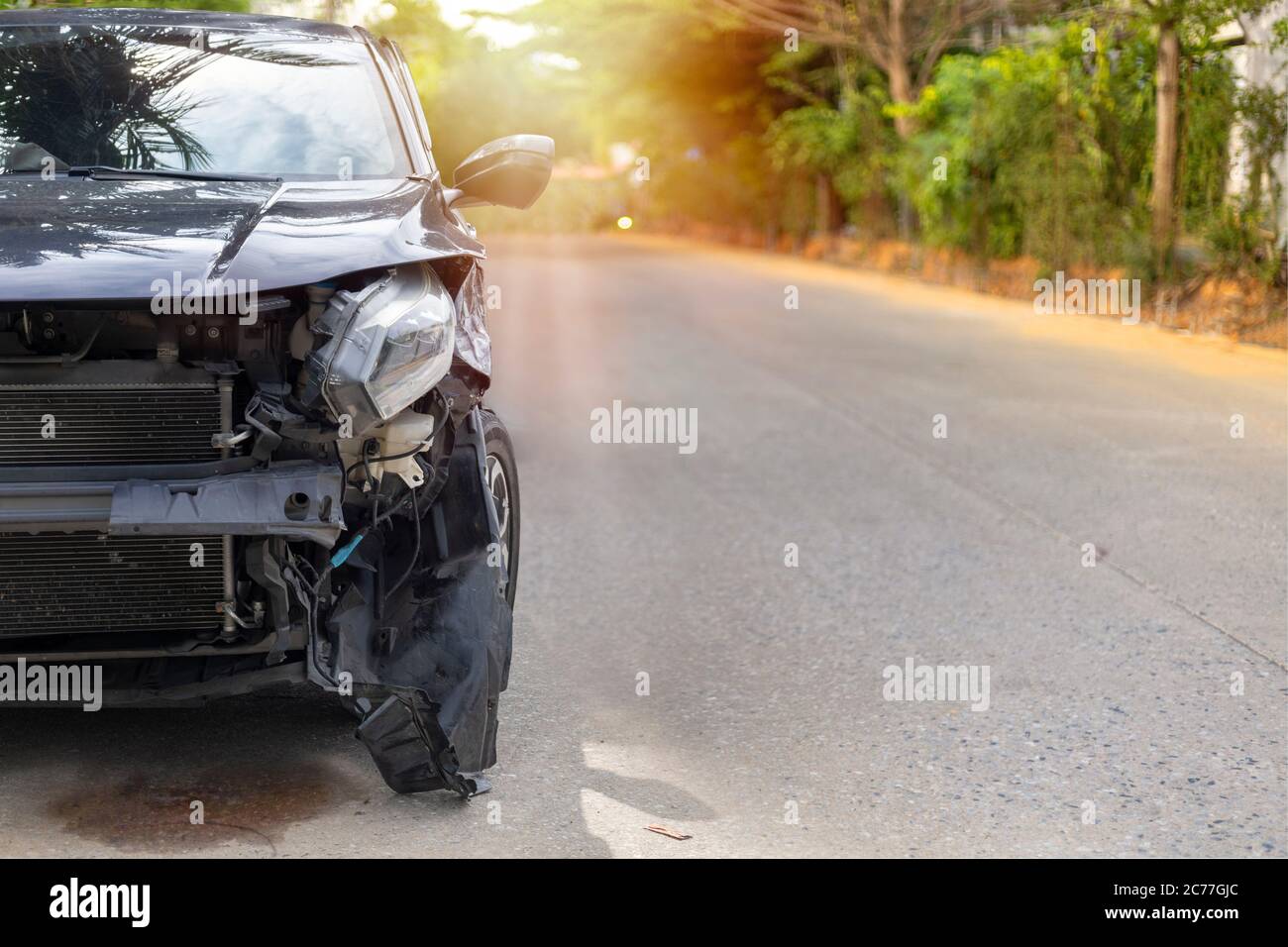 Front of black color car damaged and broken by accident . Isolate on ...