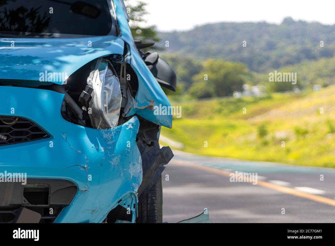 Front of blue color car big damaged and broken by accident on city ...