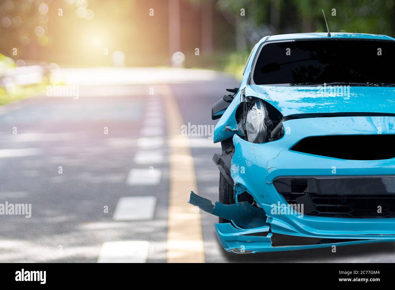 Front of blue color car big damaged and broken by accident on city ...