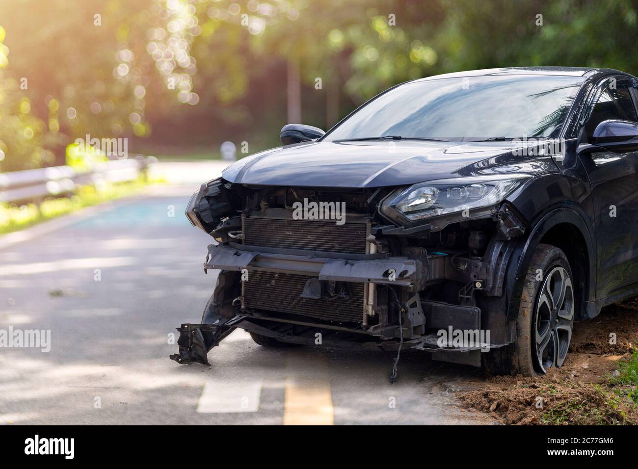 Front of black color car big damaged and broken by accident on city ...