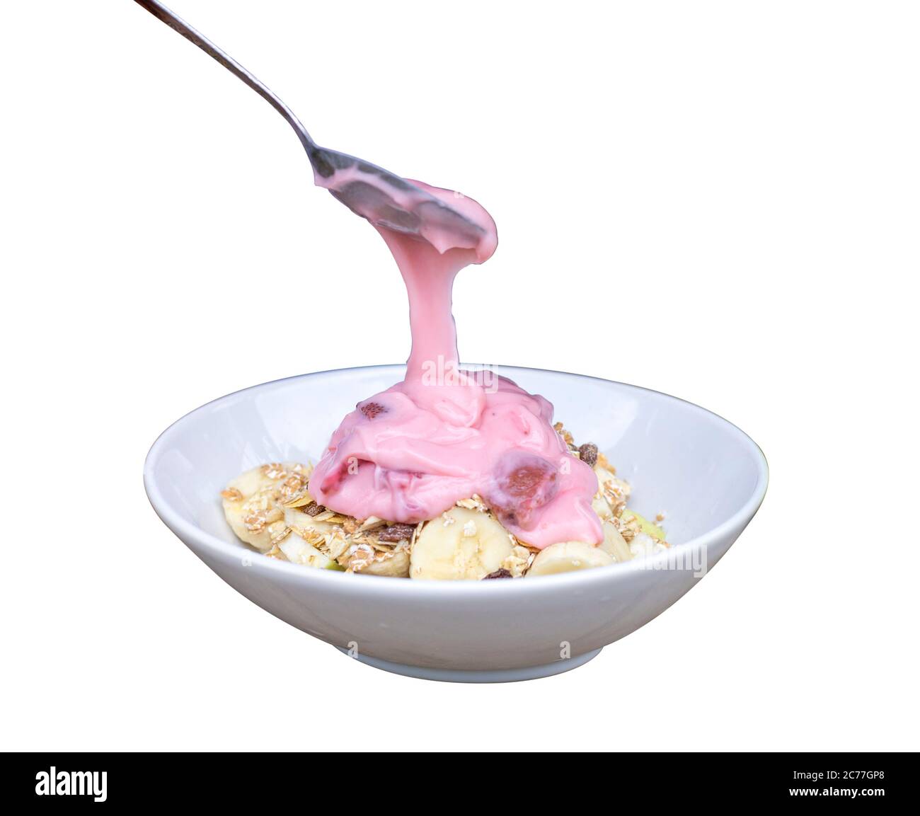 Pour yogurt strawberry from spoon to bowl and in bowl have banana slide ...