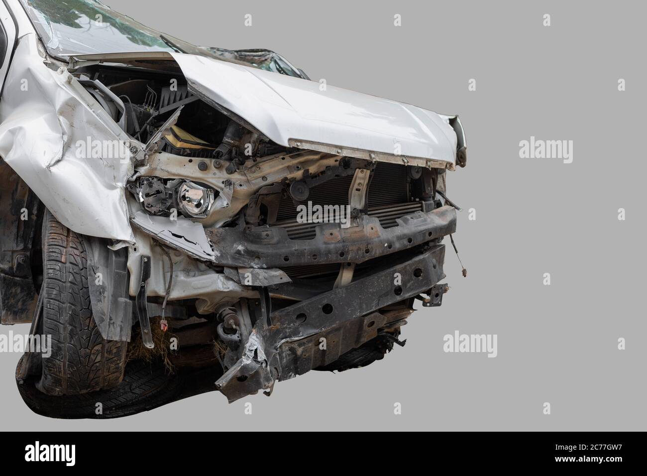 White color car damaged and broken by accident . Isolate on gray ...