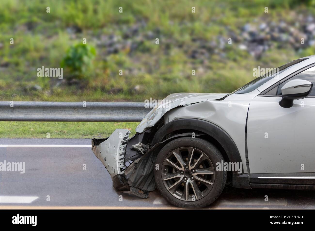 Front of gray color car damaged and broken by accident . Isolate on ...