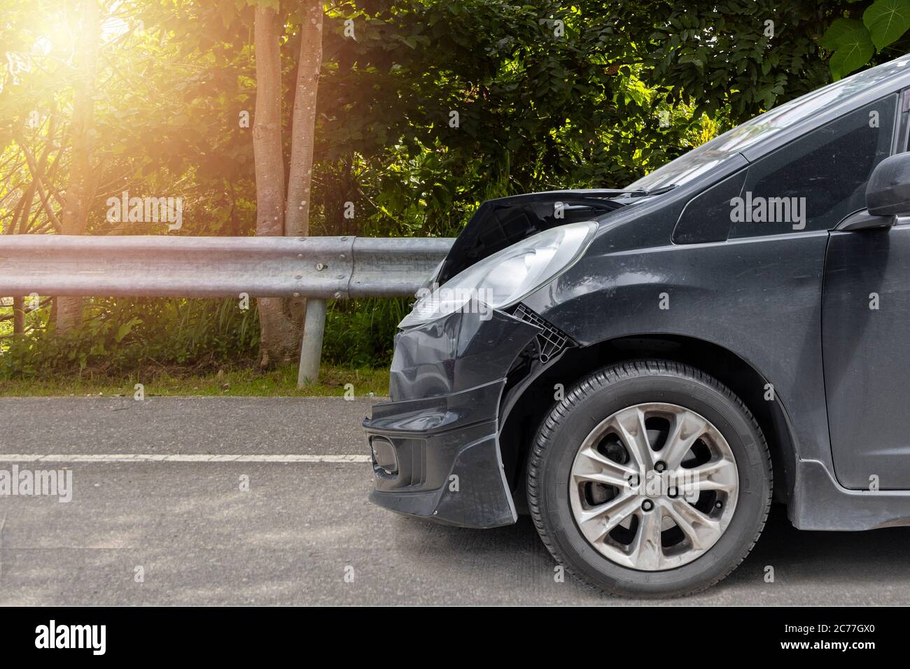 Front of black color car big damaged and broken by accident on city ...