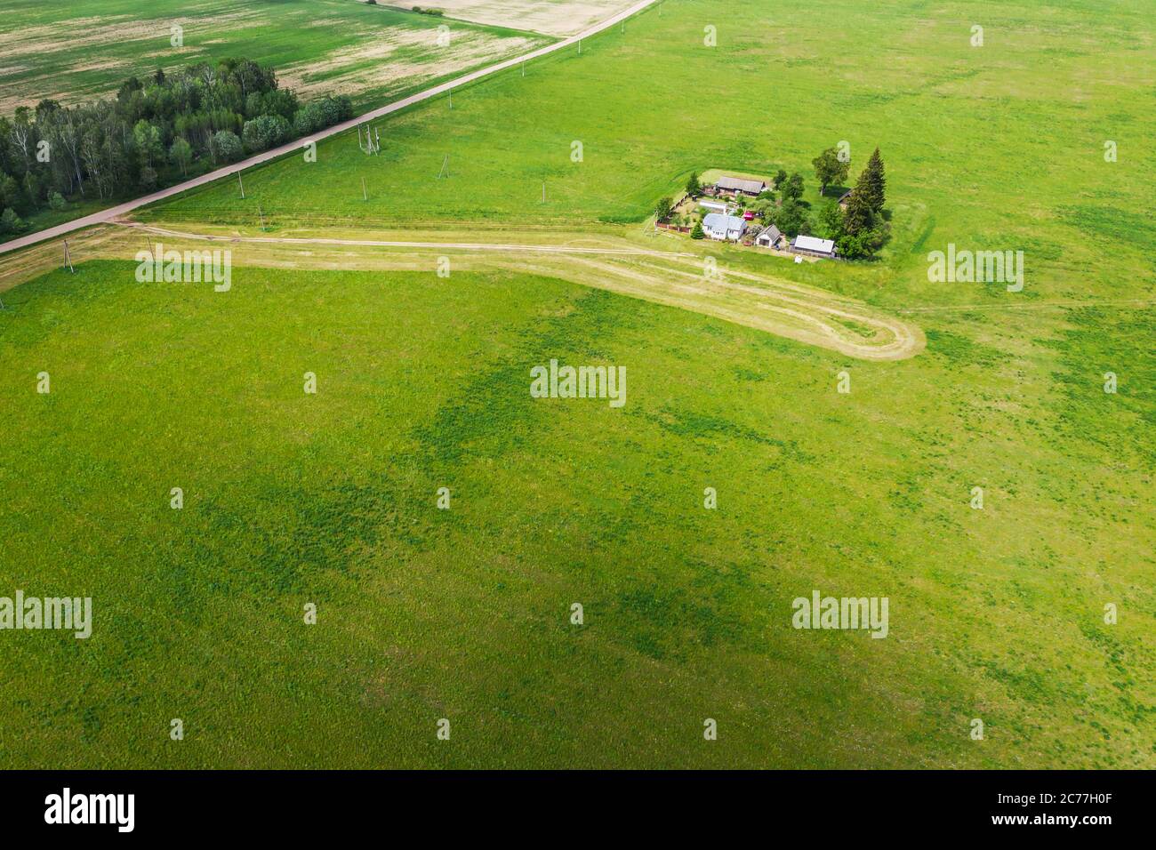 aerial view over the agricultural farm among green fields. summer ...