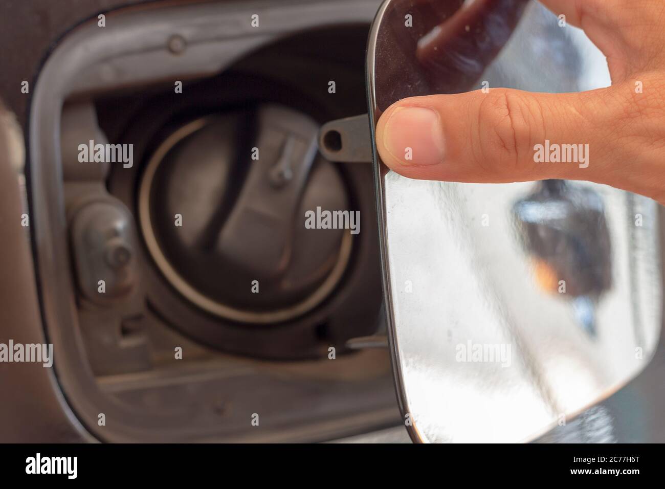 Close up hand man open the fuel tank cover in the car Stock Photo - Alamy