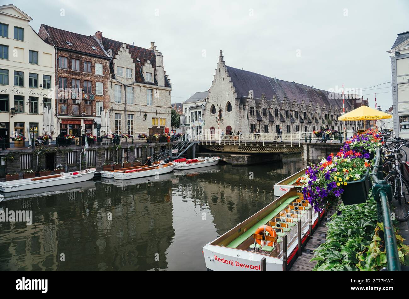 Scheldt river in Ghent with boats along the dock Stock Photo - Alamy