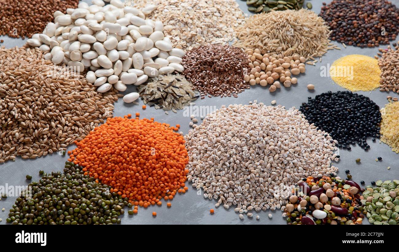 Various kinds of natural grains on grey background Stock Photo - Alamy