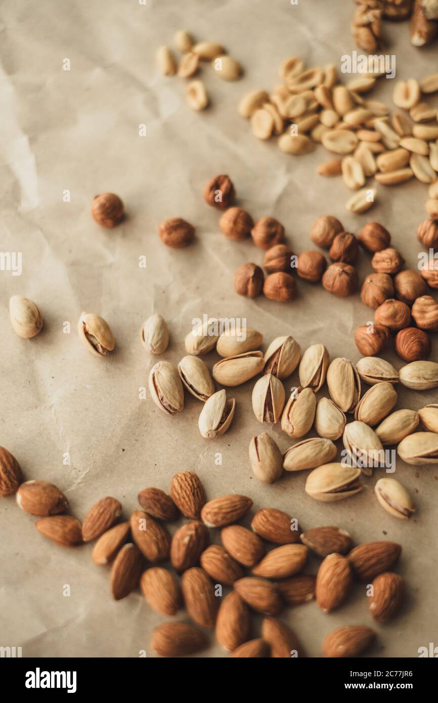 Different types of nuts, nut mix of almonds, hazelnuts, cashews ...