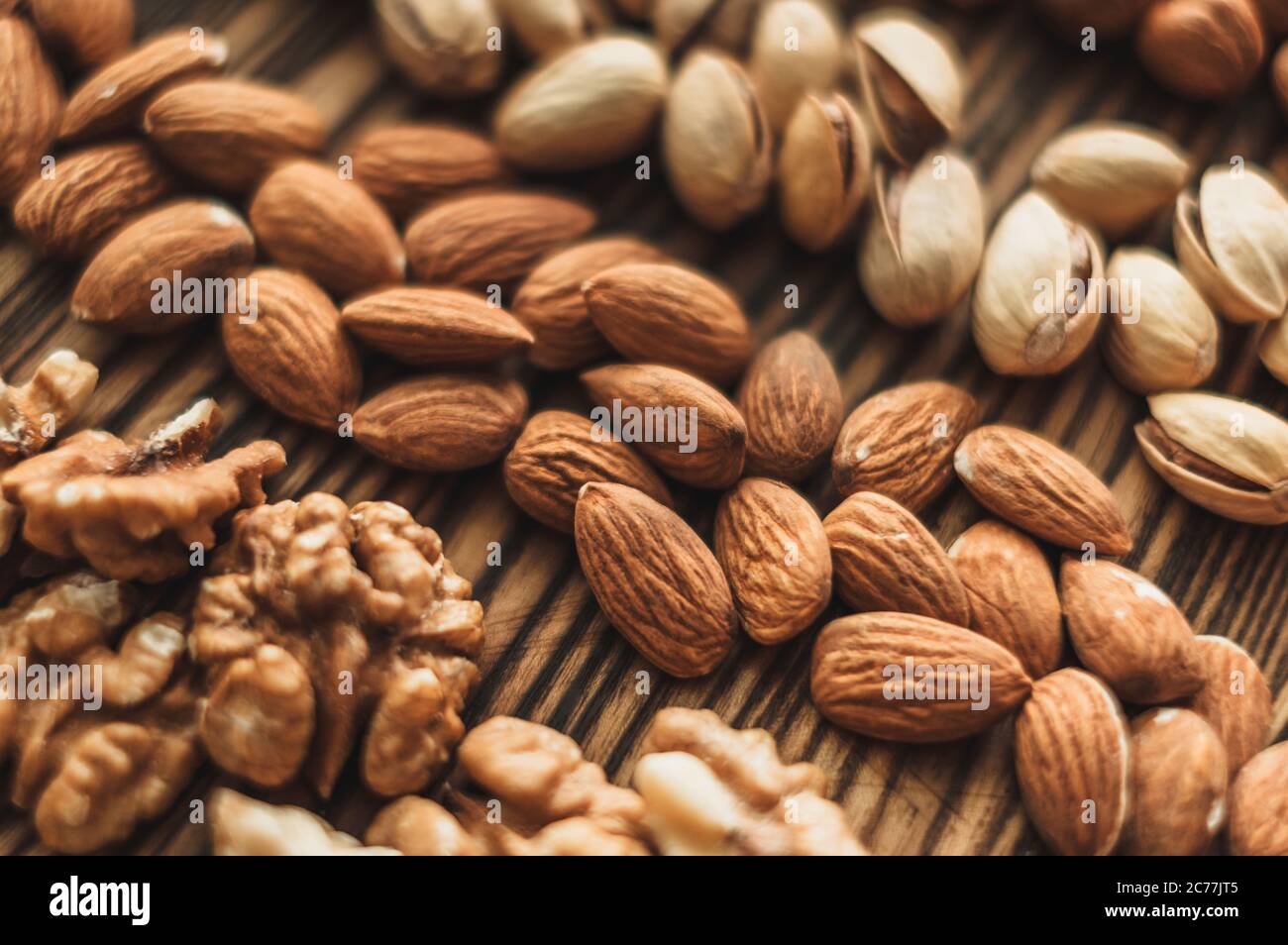 Different types of nuts, nut mix of almonds, hazelnuts, cashews ...