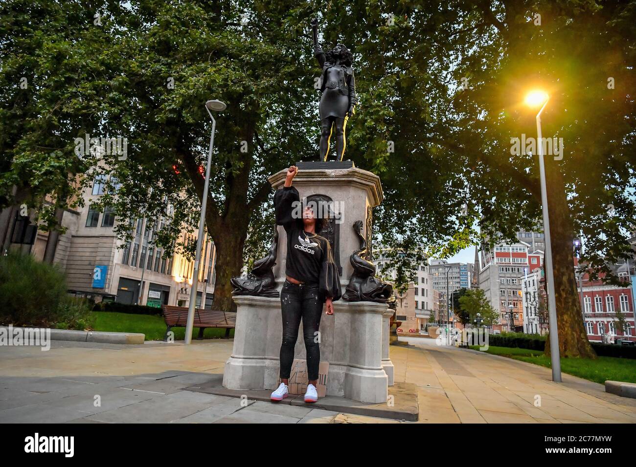 Jen Reid poses in front of her black resin and steel statue titled A ...