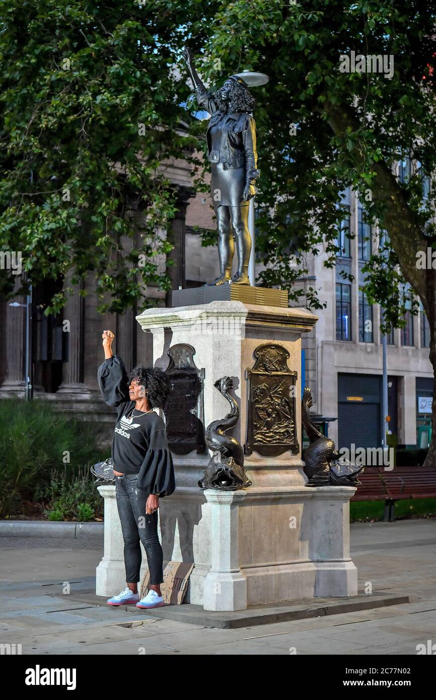 Jen Reid poses in front of her black resin and steel statue titled A ...