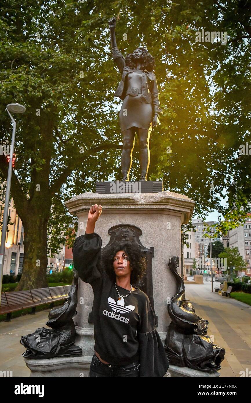 Jen Reid poses in front of her black resin and steel statue titled A ...