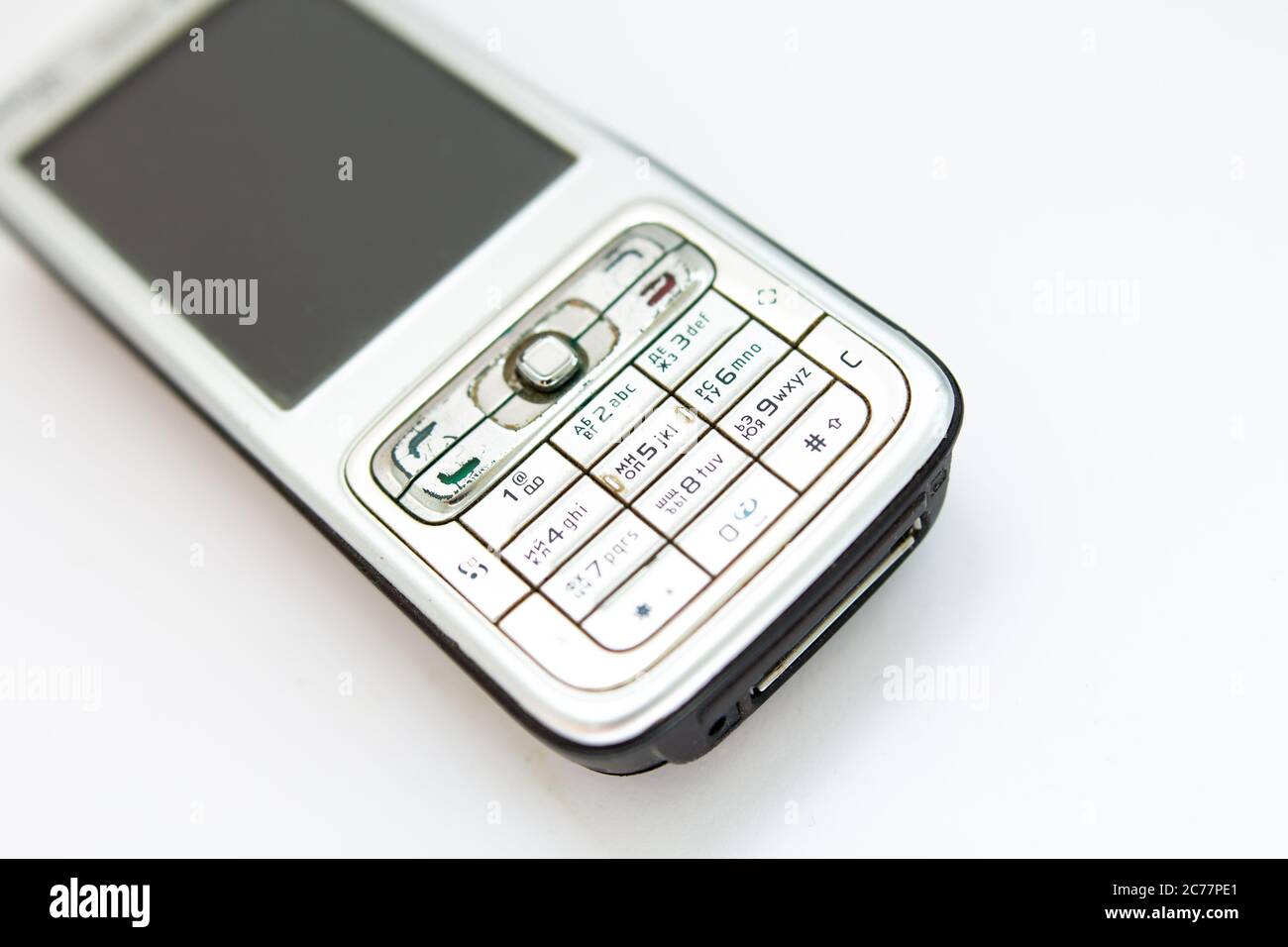 old push-button smartphone on white background Stock Photo - Alamy