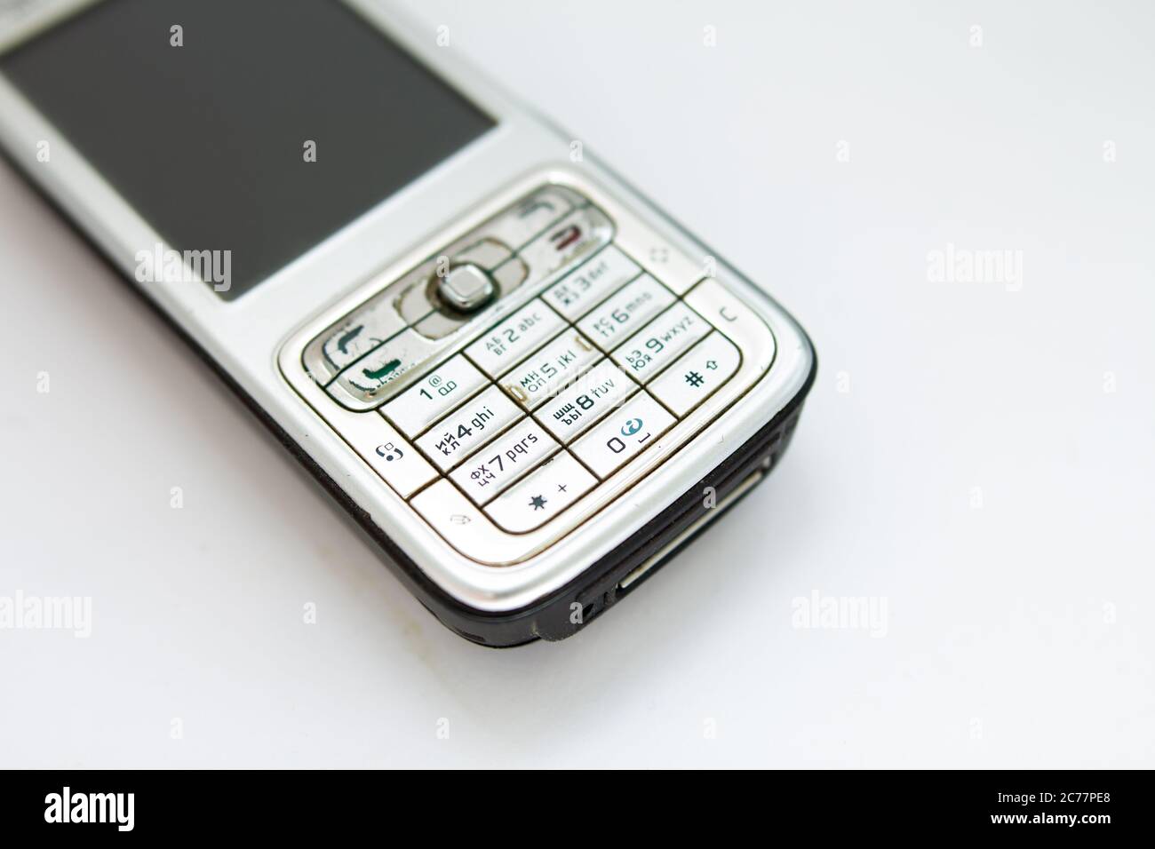 old push-button smartphone on white background Stock Photo - Alamy