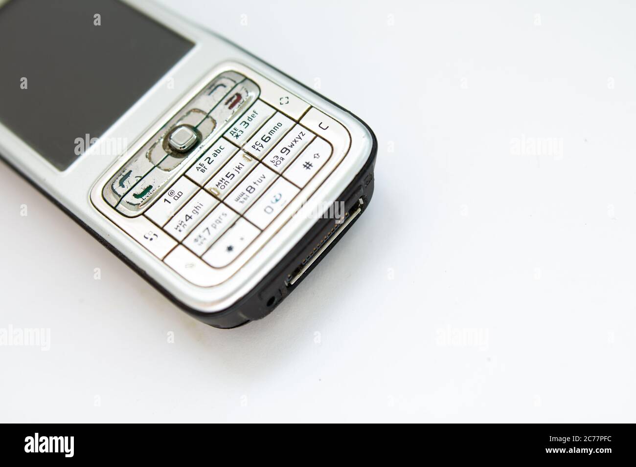 old push-button smartphone on white background Stock Photo - Alamy