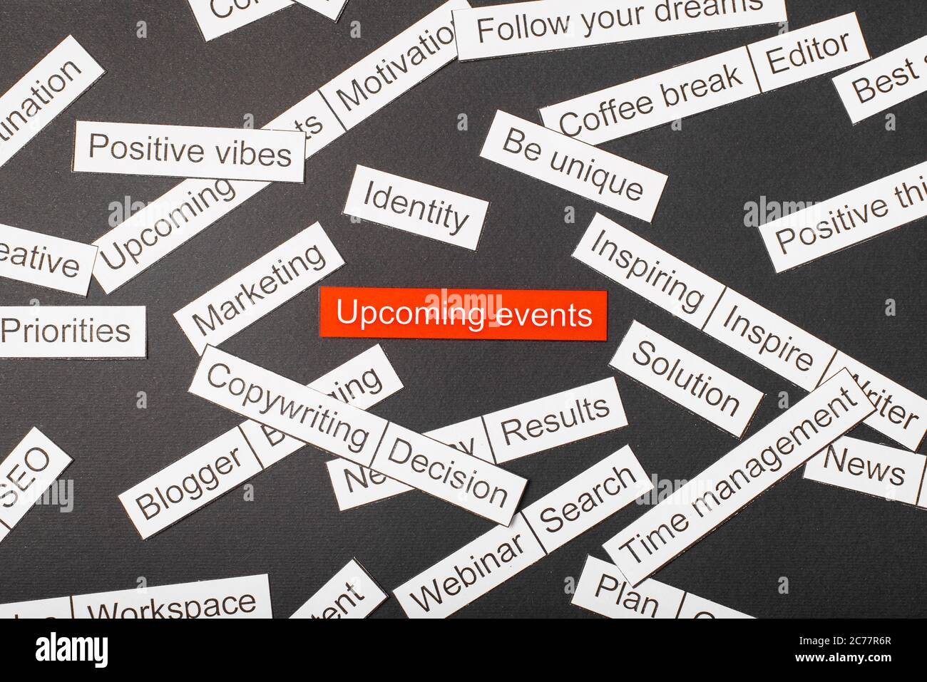 Cut paper inscription upcoming events on a red background, surrounded ...