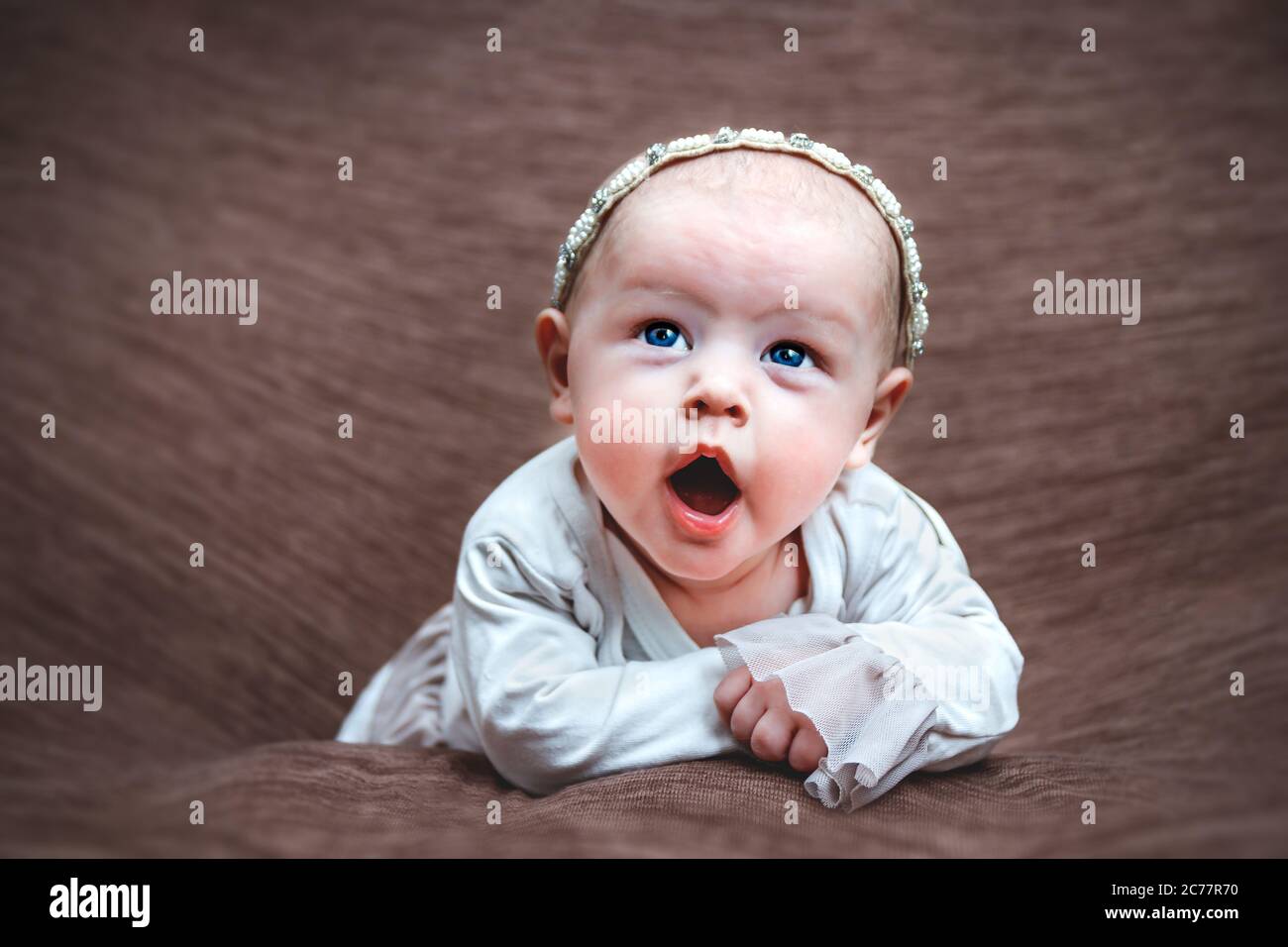 Baby girl closeup facial expression Stock Photo - Alamy