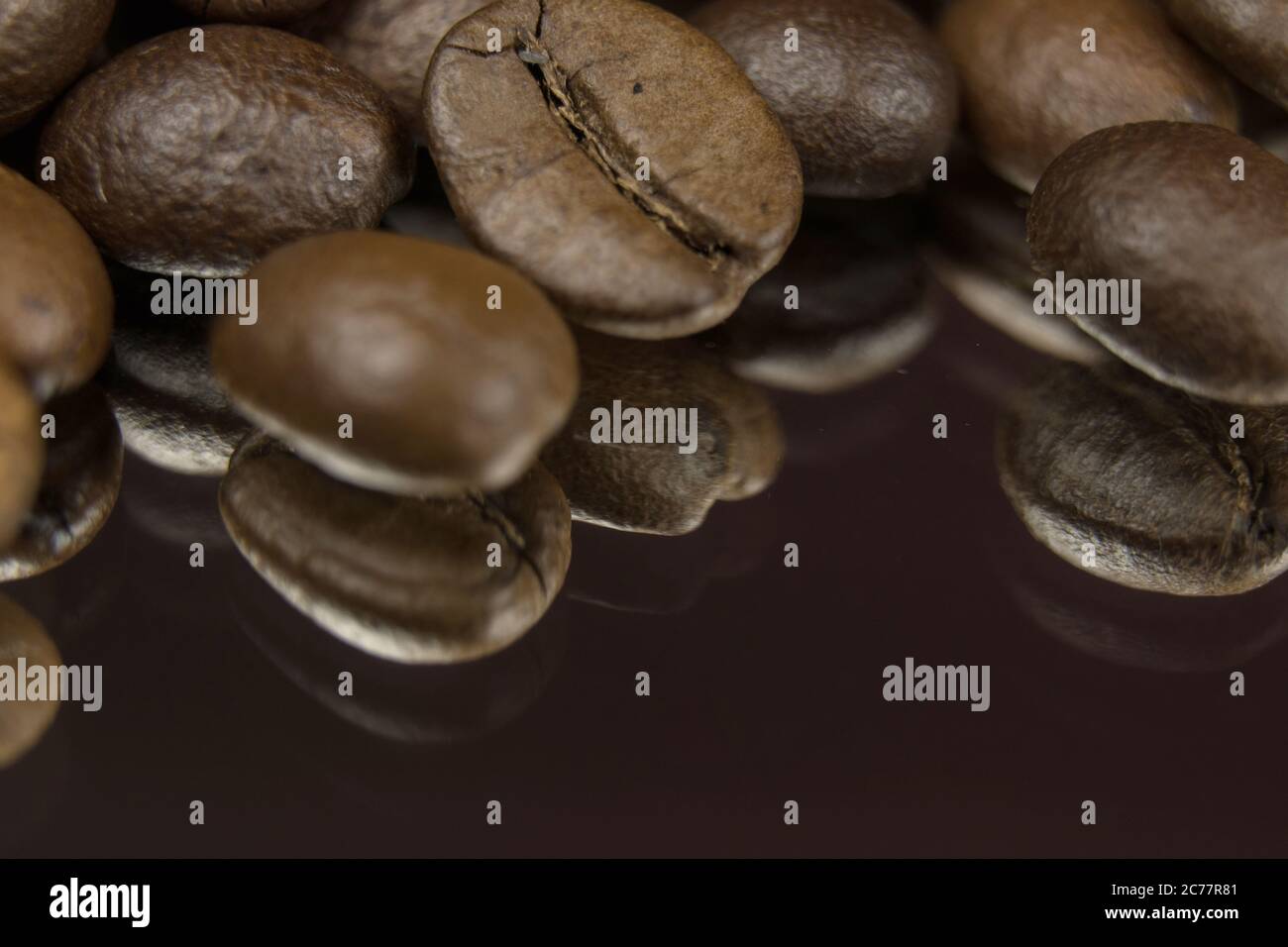 Fragrant fried coffee beans. close-up texture Gold coffee bean Stock ...