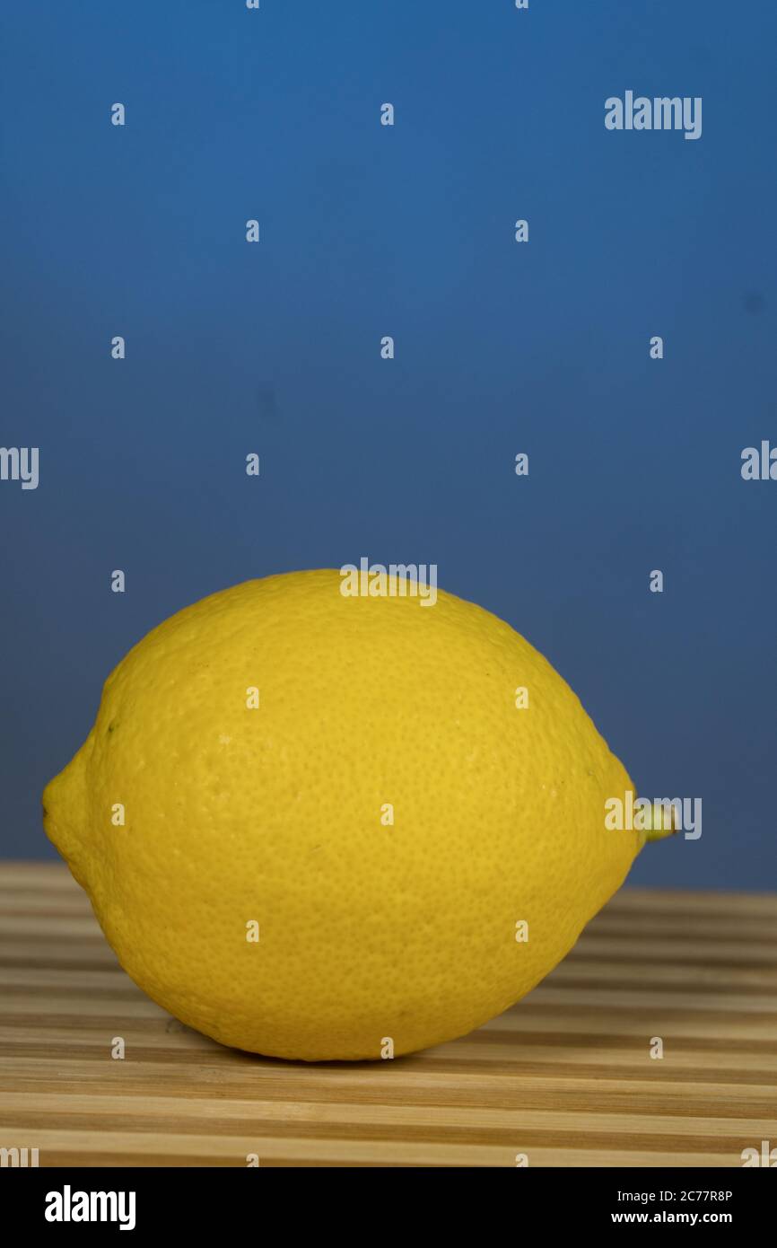 Citrus fruits- lemon, on the wooden , On a blue background Stock Photo ...