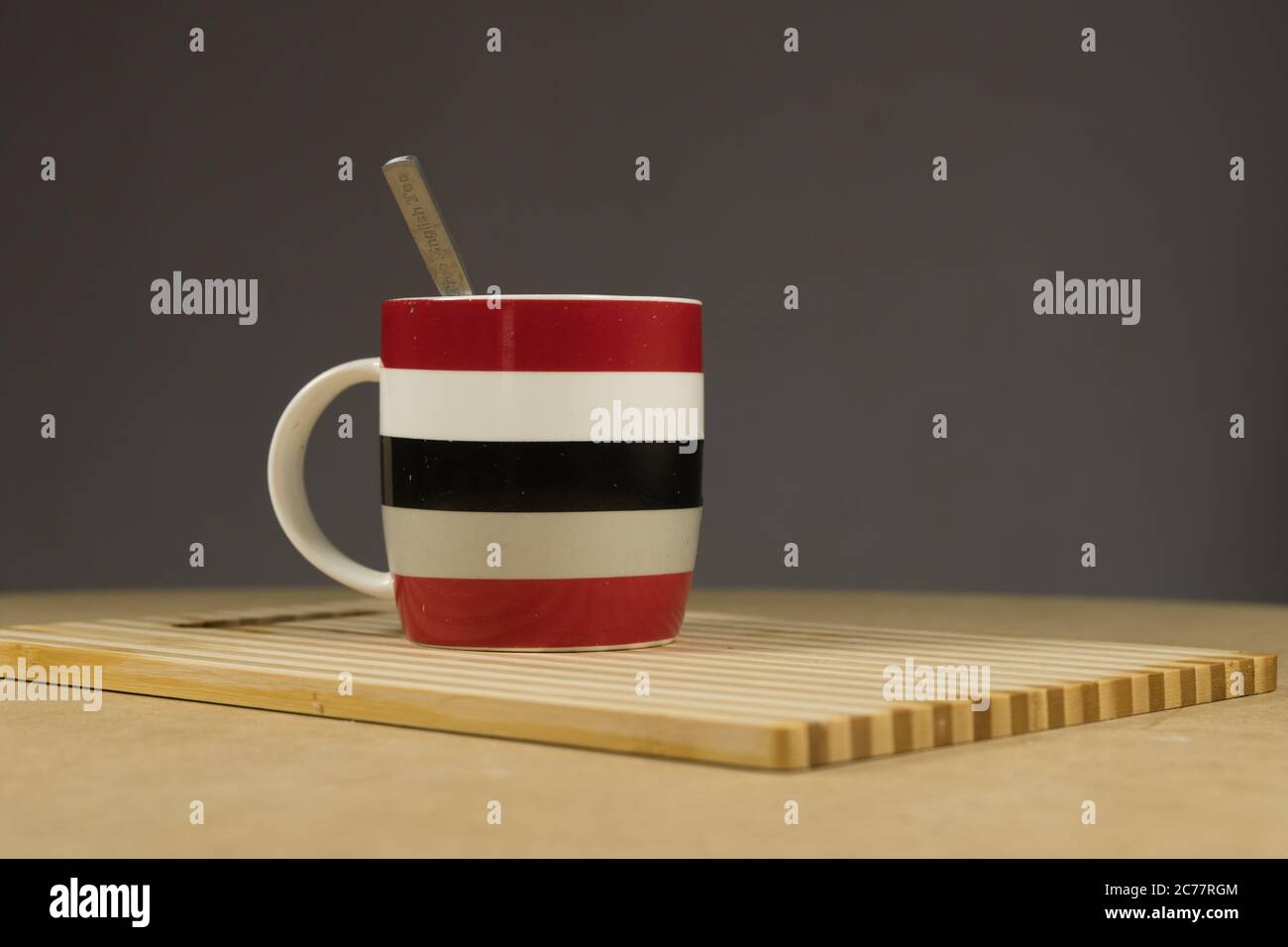 Red-white-blue mug on a blue background. The concept of a friendly ...