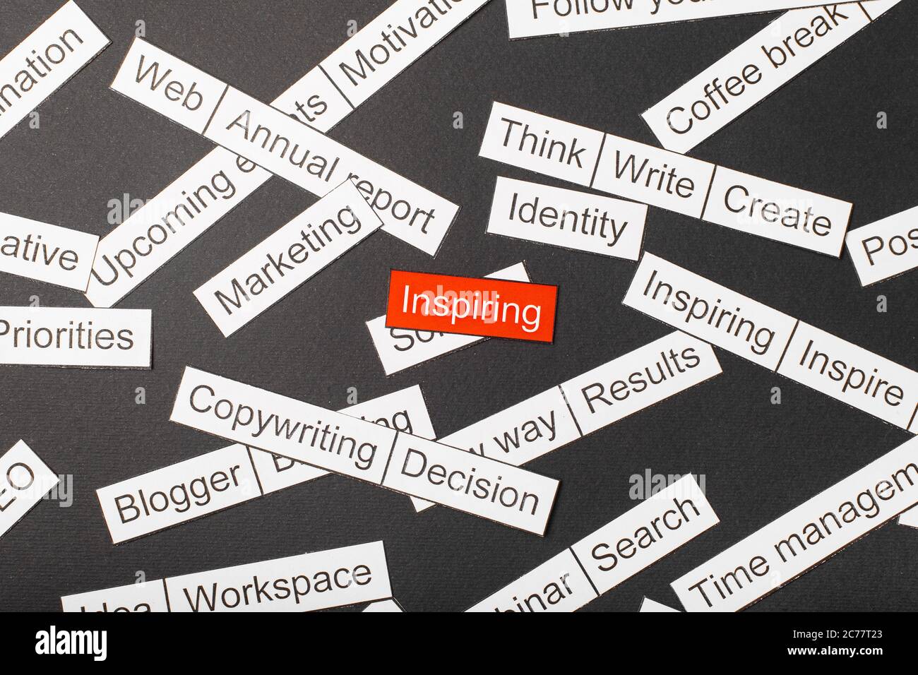 Cut paper inscription inspiring on a red background, surrounded by ...