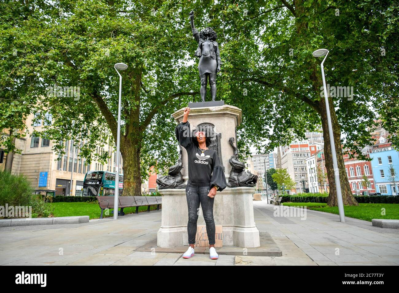 Jen Reid poses in front of her black resin and steel statue titled A ...