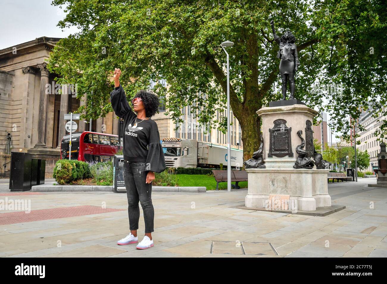 Jen Reid poses in front of her black resin and steel statue titled A ...
