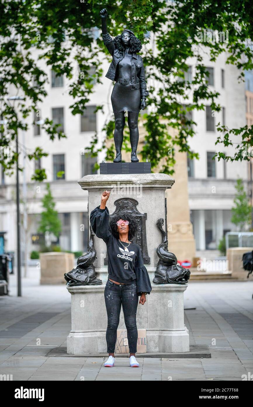 Jen Reid poses in front of her black resin and steel statue titled A ...