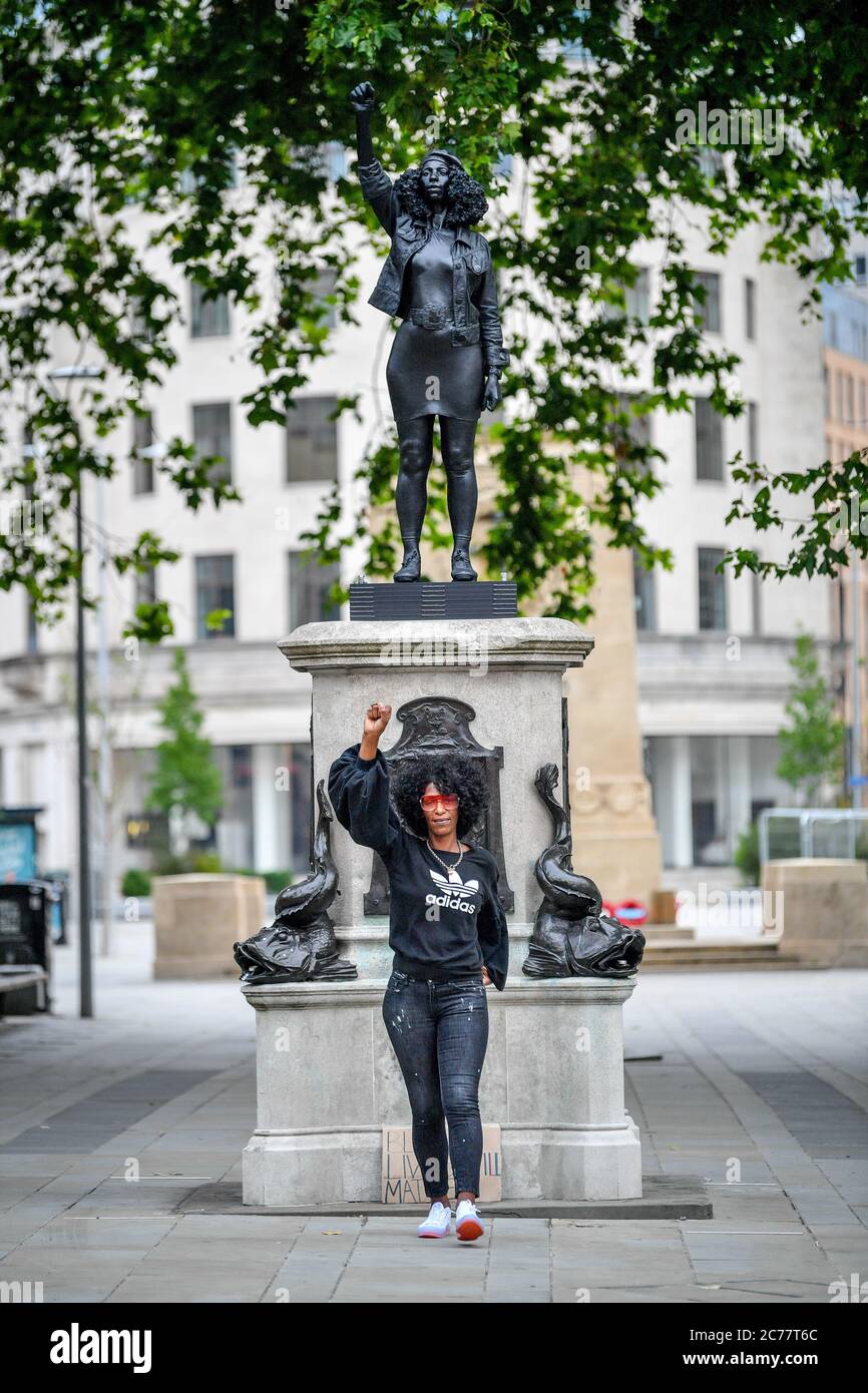 Jen Reid poses in front of her black resin and steel statue titled A ...