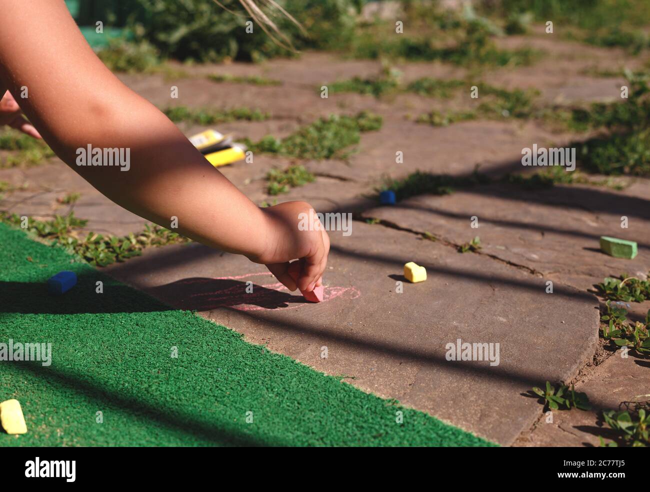 children's hand draws with crayons on the pavement Stock Photo - Alamy
