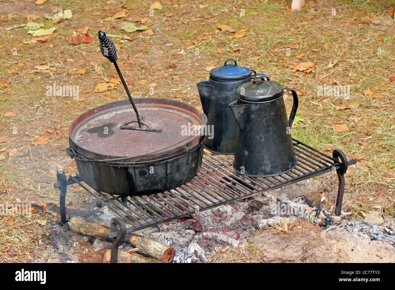 Campfire cooking outdoors on an open flam Stock Photo - Alamy
