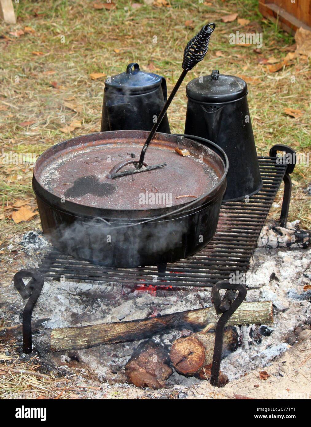 Campfire cooking outdoors on an open flam Stock Photo - Alamy