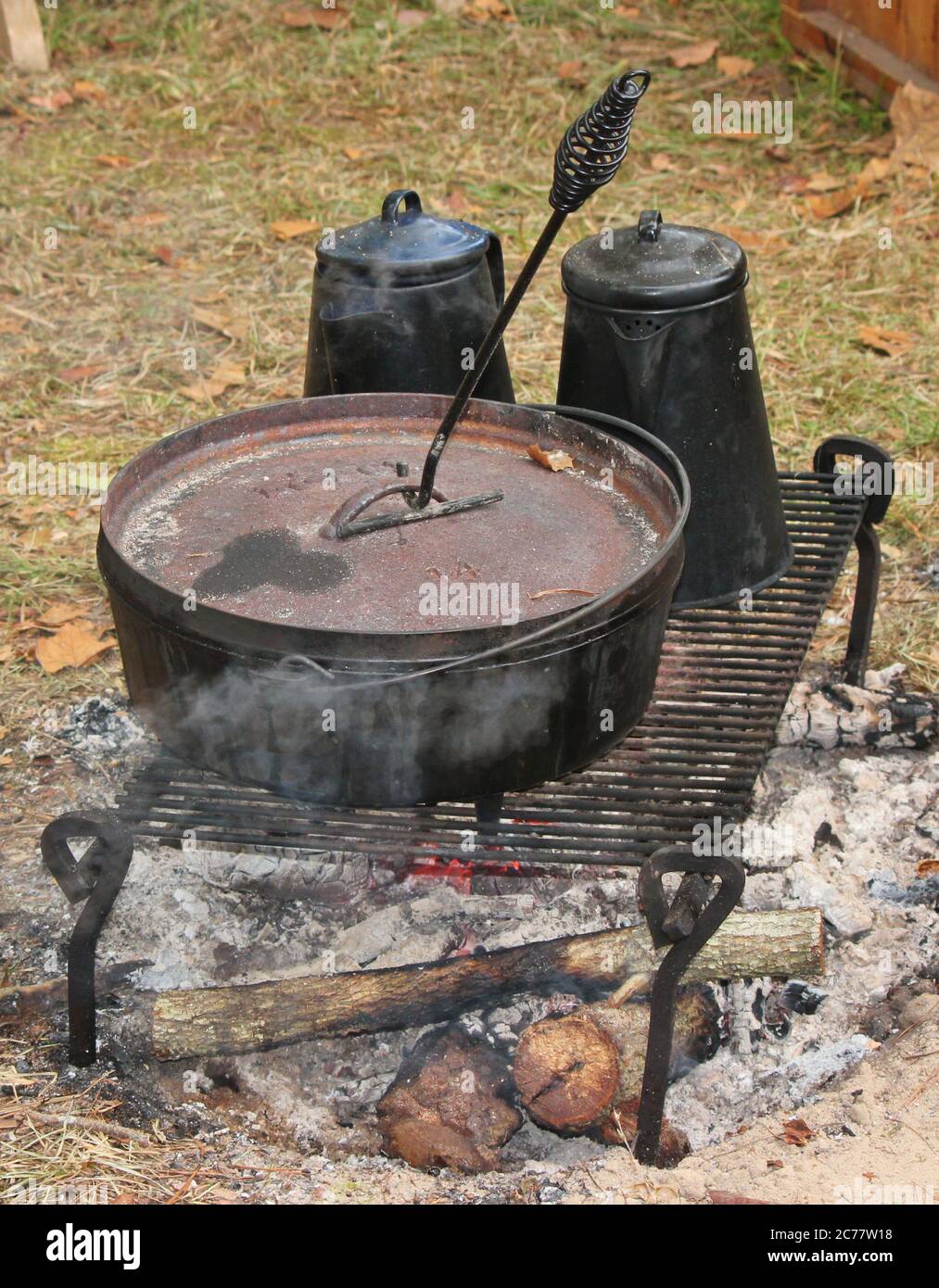 Campfire cooking outdoors on an open flam Stock Photo - Alamy