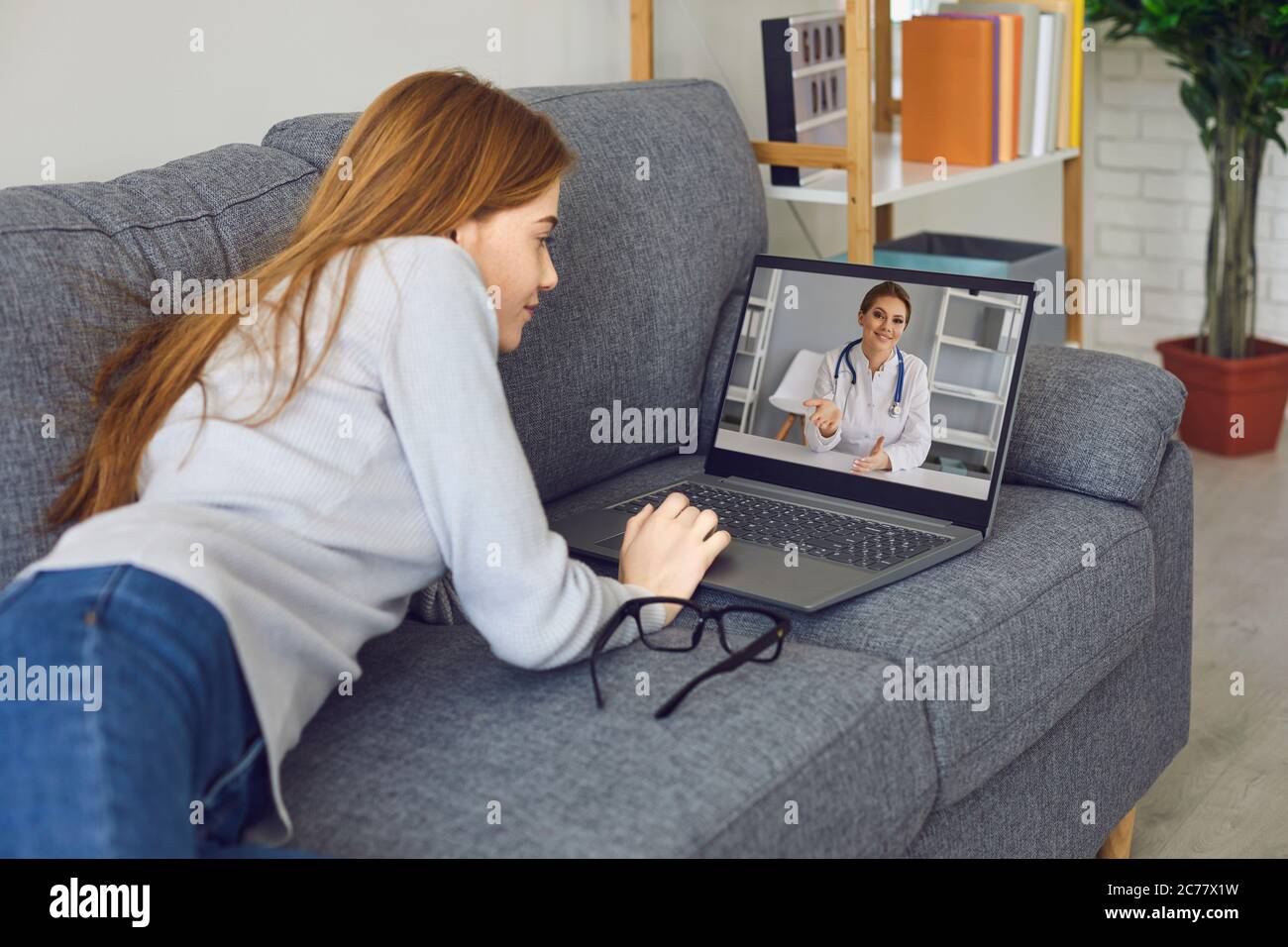 Female patient seeking help from online doctor at home. Doctor online ...