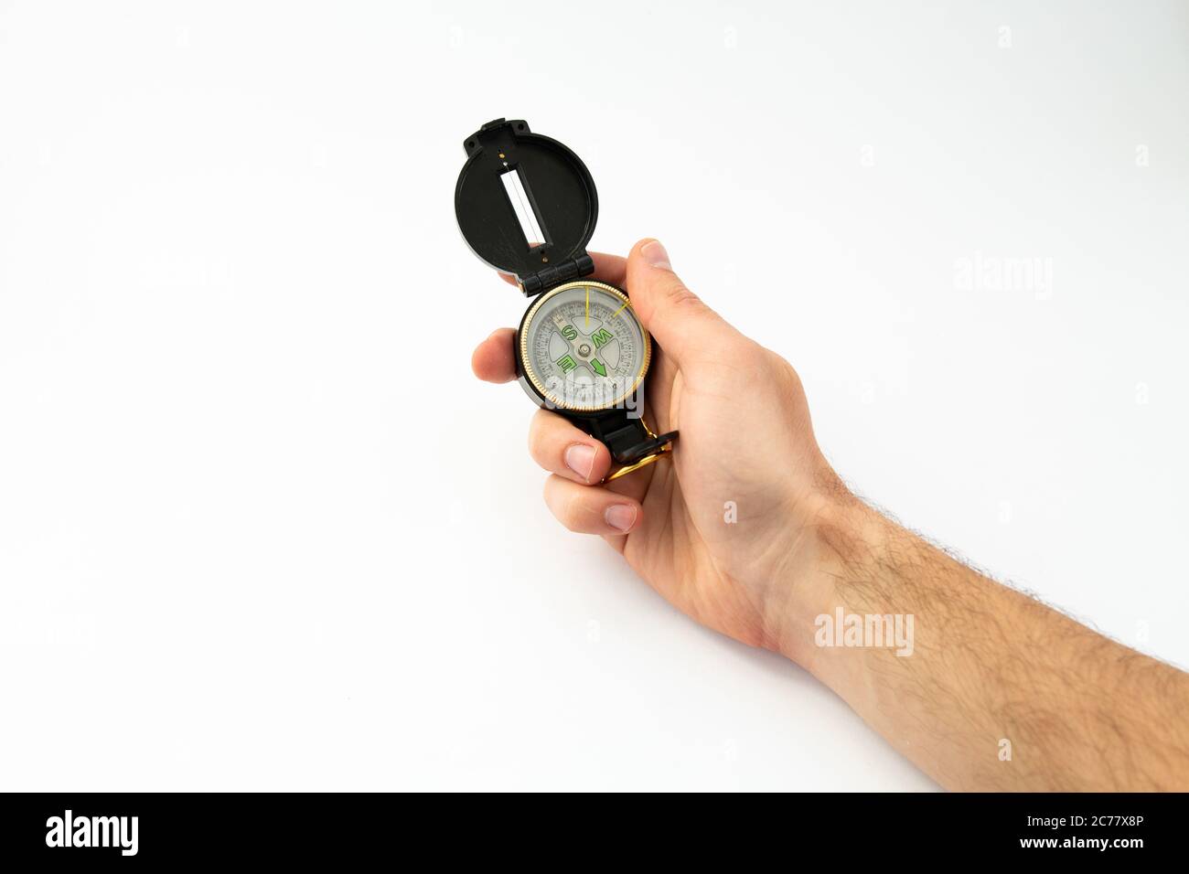 compass in hand on white background Stock Photo - Alamy