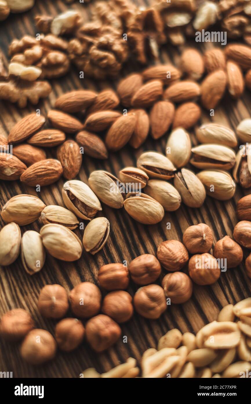 Different types of nuts, nut mix of almonds, hazelnuts, cashews ...