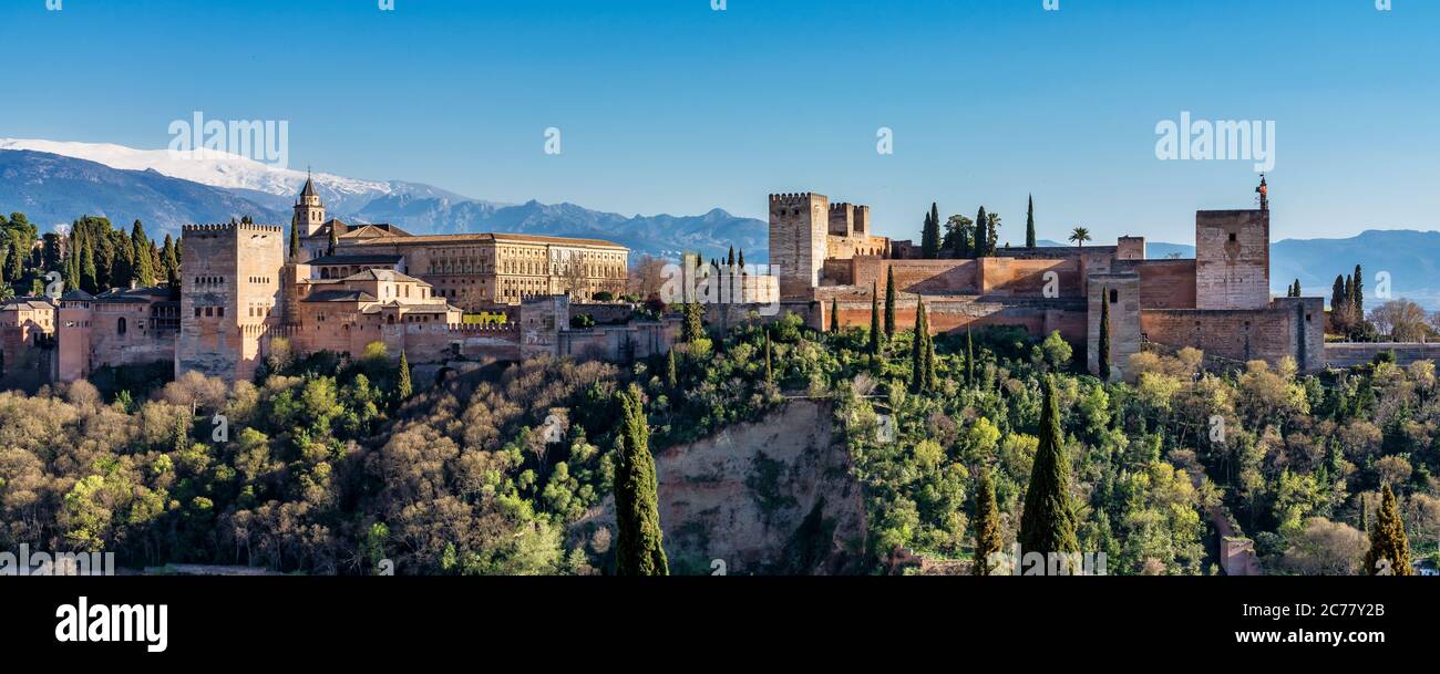 View of Alhambra Palace in Granada, Spain with Sierra Nevada mountains ...