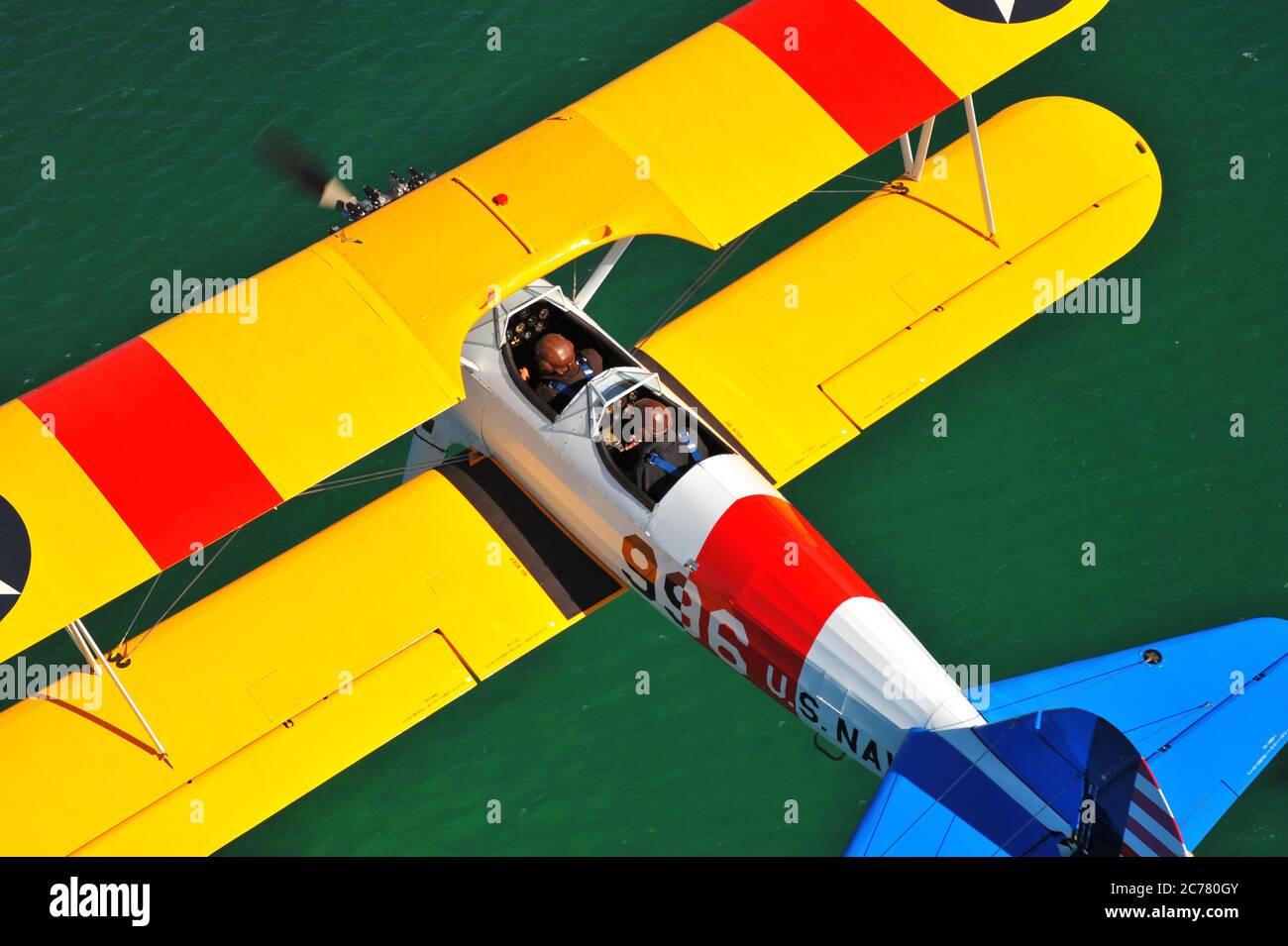 A restored 1940's US Navy Boeing Stearman N2S biplane trainer over the ...