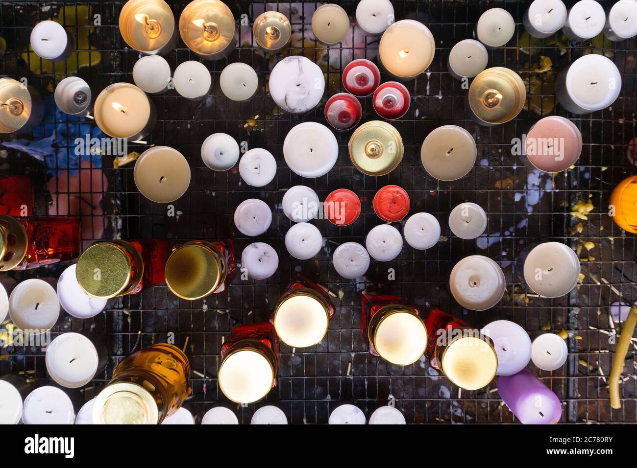 Church candles and lamps for the repose in a catholic church. Christian ...
